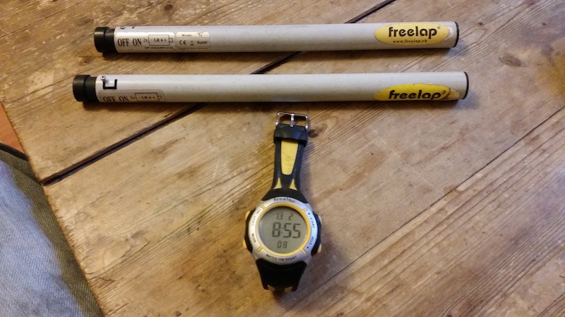freelap timing watch and two poles For Sale