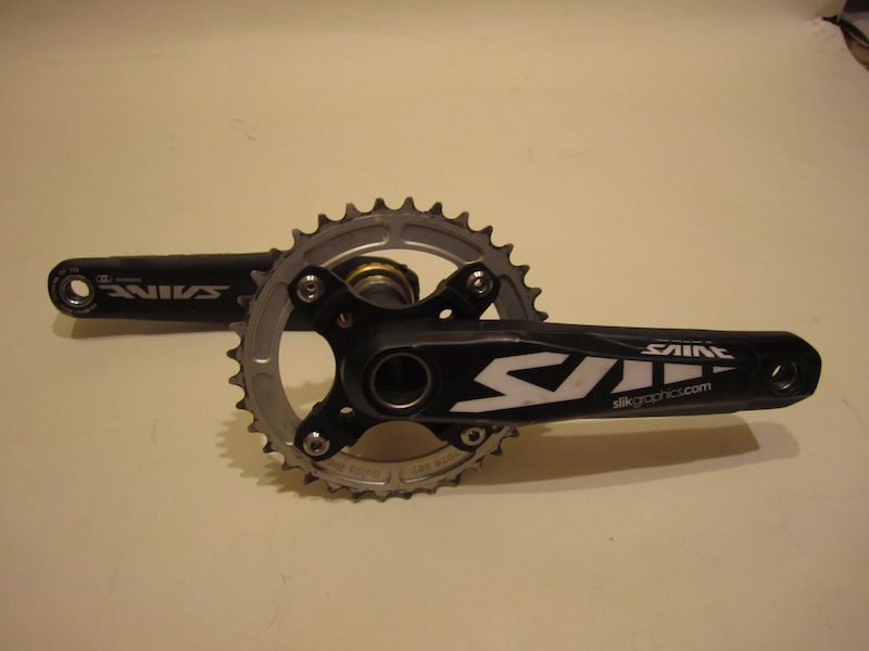 Saint M810 cranks + BB, E13 ring, and slik graphics rub prot For Sale