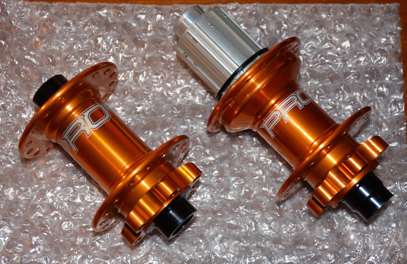 2016 Hope Pro 4 hubset, 32h, 142x12mm / 100x15mm, Orange For Sale