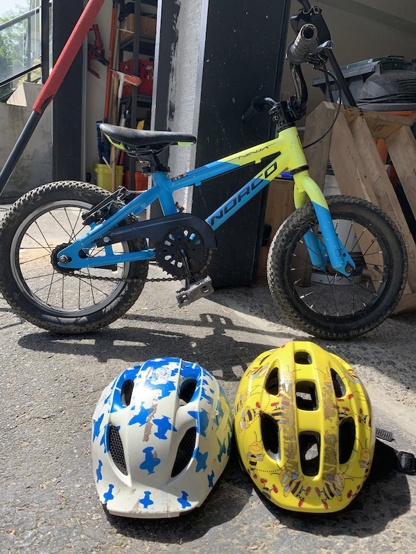 Norco Ninja 14” with helmets For Sale
