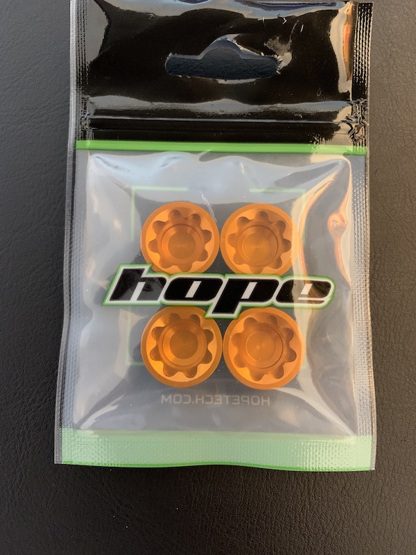 Hope Tech 3 E4 Bore Caps - Orange. For Sale