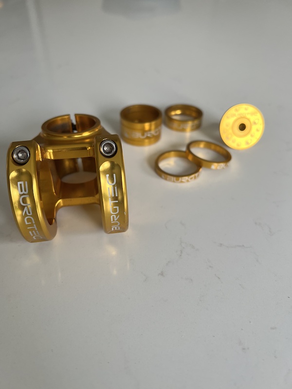 2023 Burgtec 35mm stem, spacers, top cap and bolt in gold For Sale