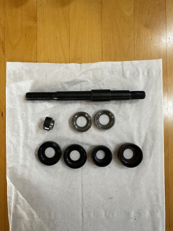 Campagnolo Rear Hub axle and cups and cones For Sale