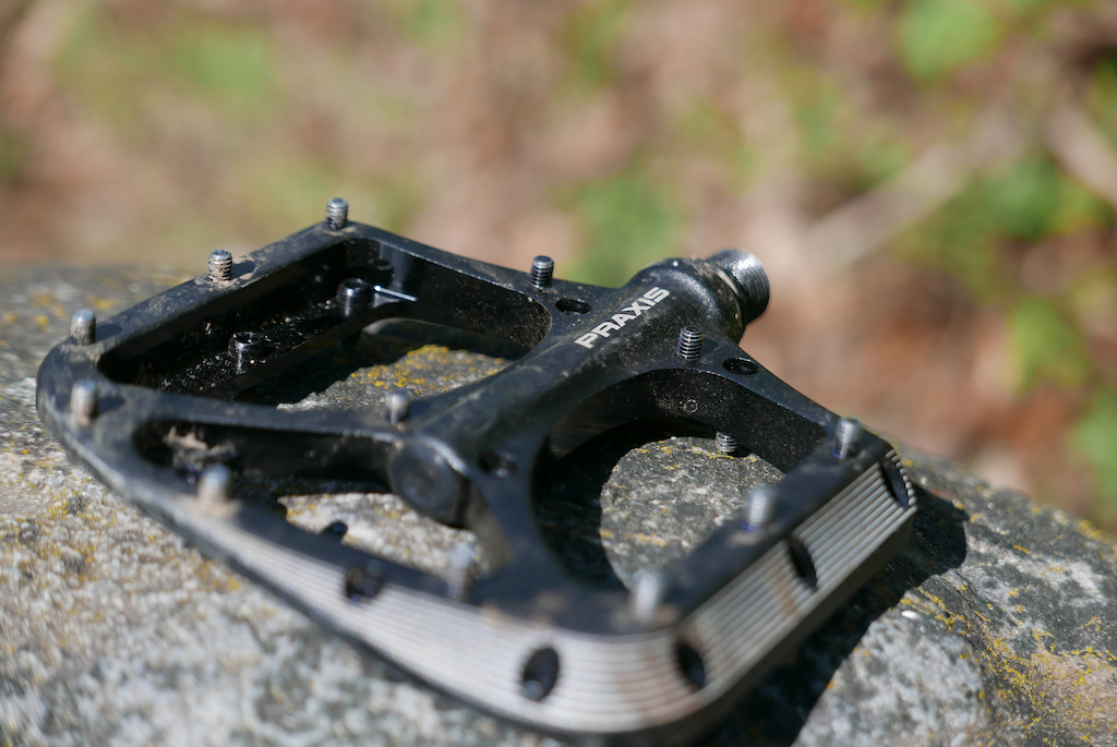 Praxis' New Flat Pedals, Stem, & Carbon Bottle Cage - Pinkbike